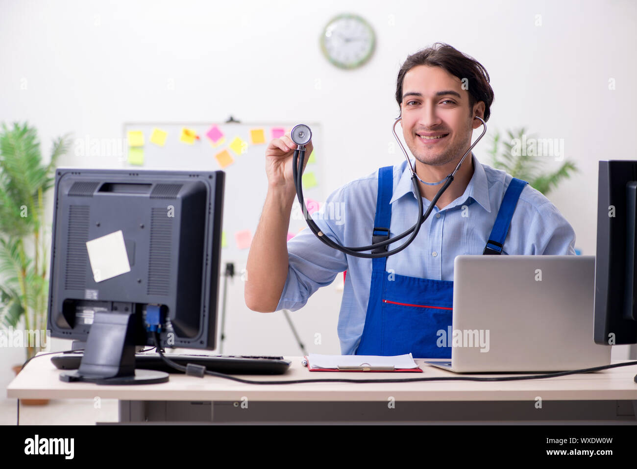 Male it specialist working in the office Stock Photo - Alamy