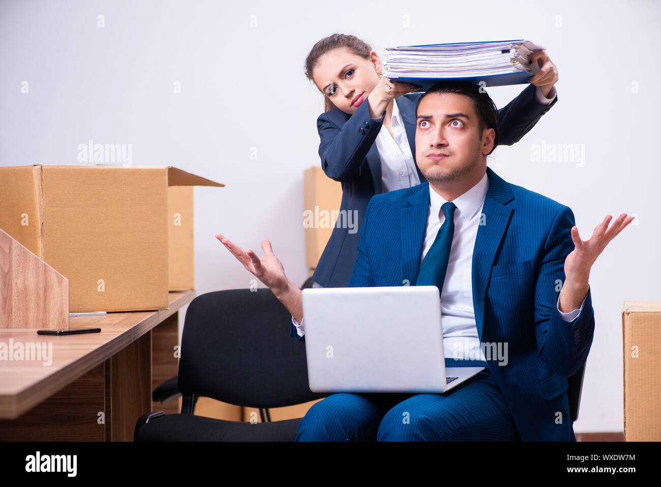 Two employees being fired from their work Stock Photo - Alamy