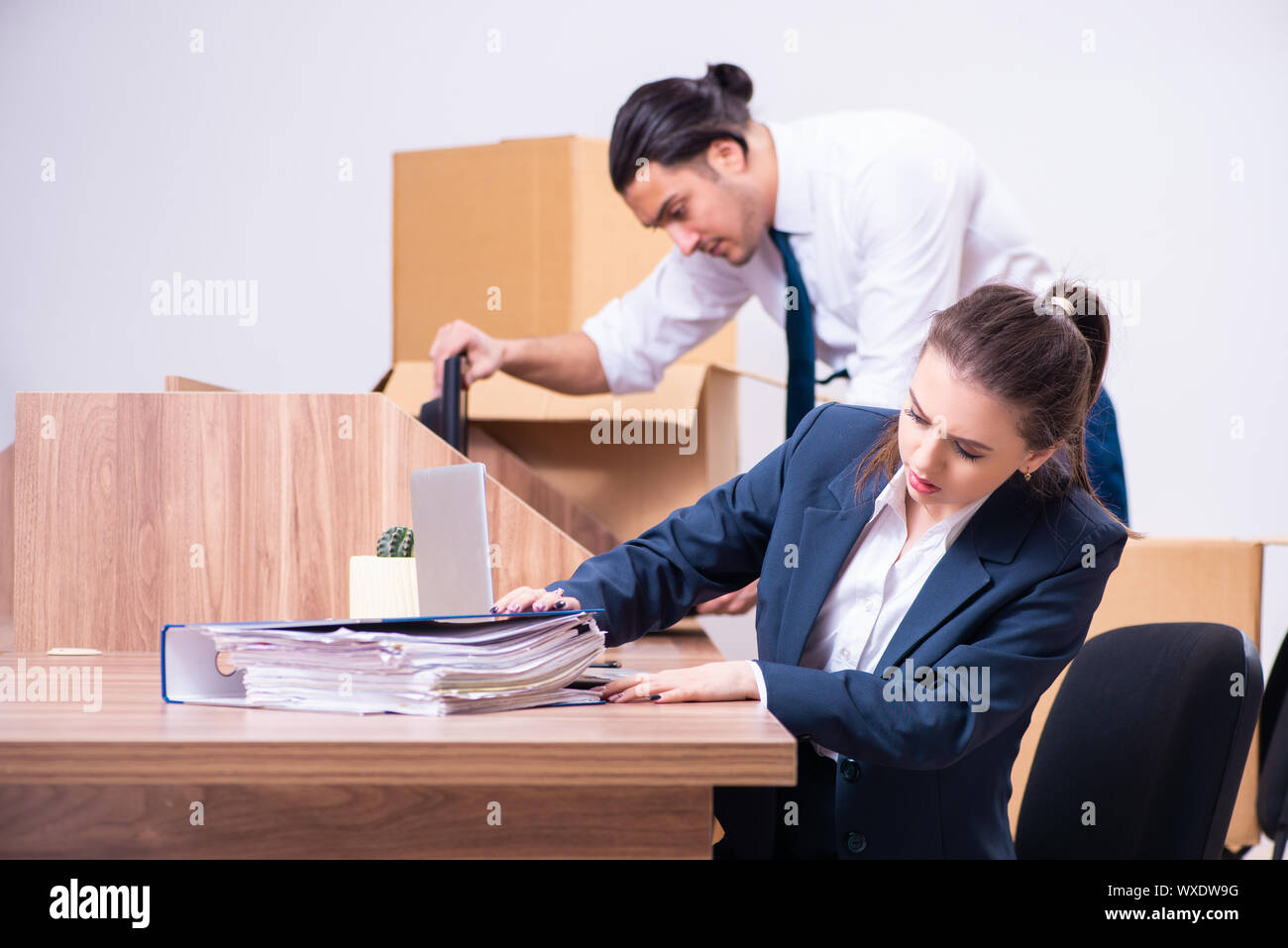 Two employees being fired from their work Stock Photo - Alamy