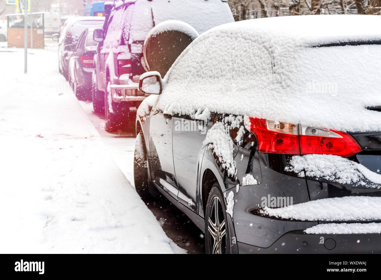 Snow covered cars Stock Photo - Alamy