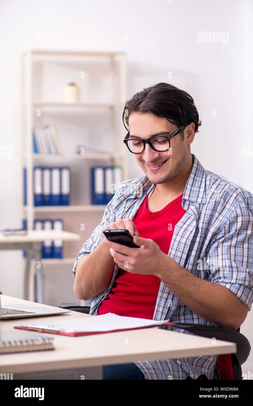 Male it specialist working in the office Stock Photo - Alamy