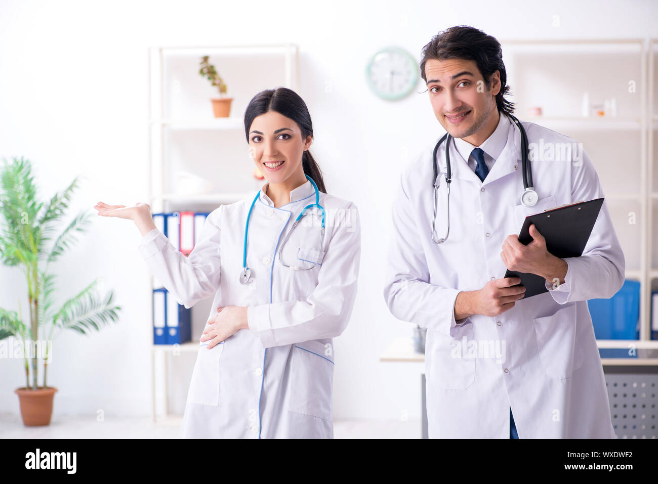 Two young doctors working in the clinic Stock Photo - Alamy