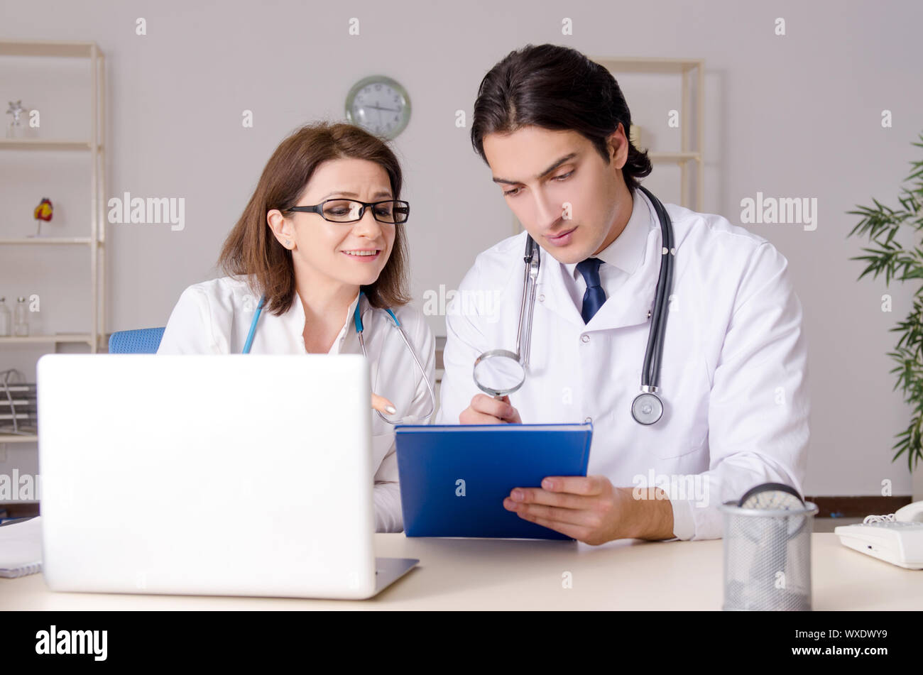 Two doctors working in the clinic Stock Photo - Alamy