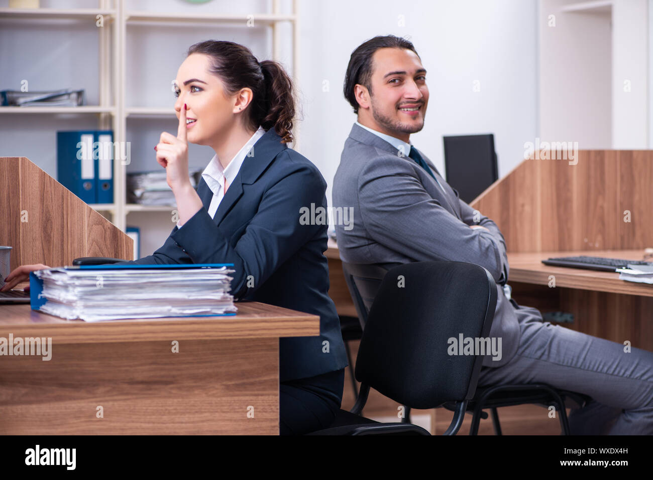Two employees working in the office Stock Photo - Alamy