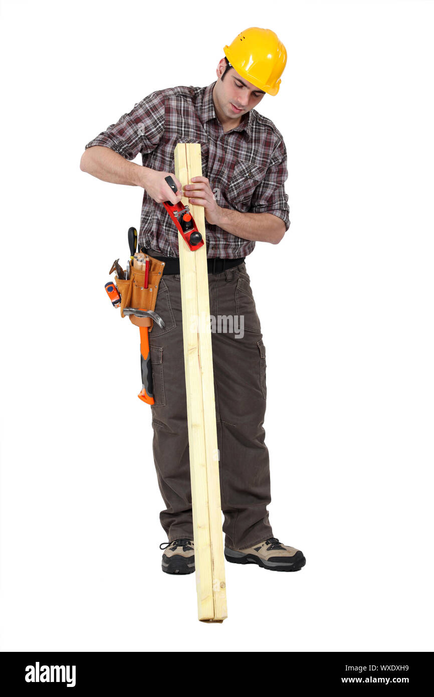 Worker carpenter repairing wooden Cut Out Stock Images & Pictures - Alamy
