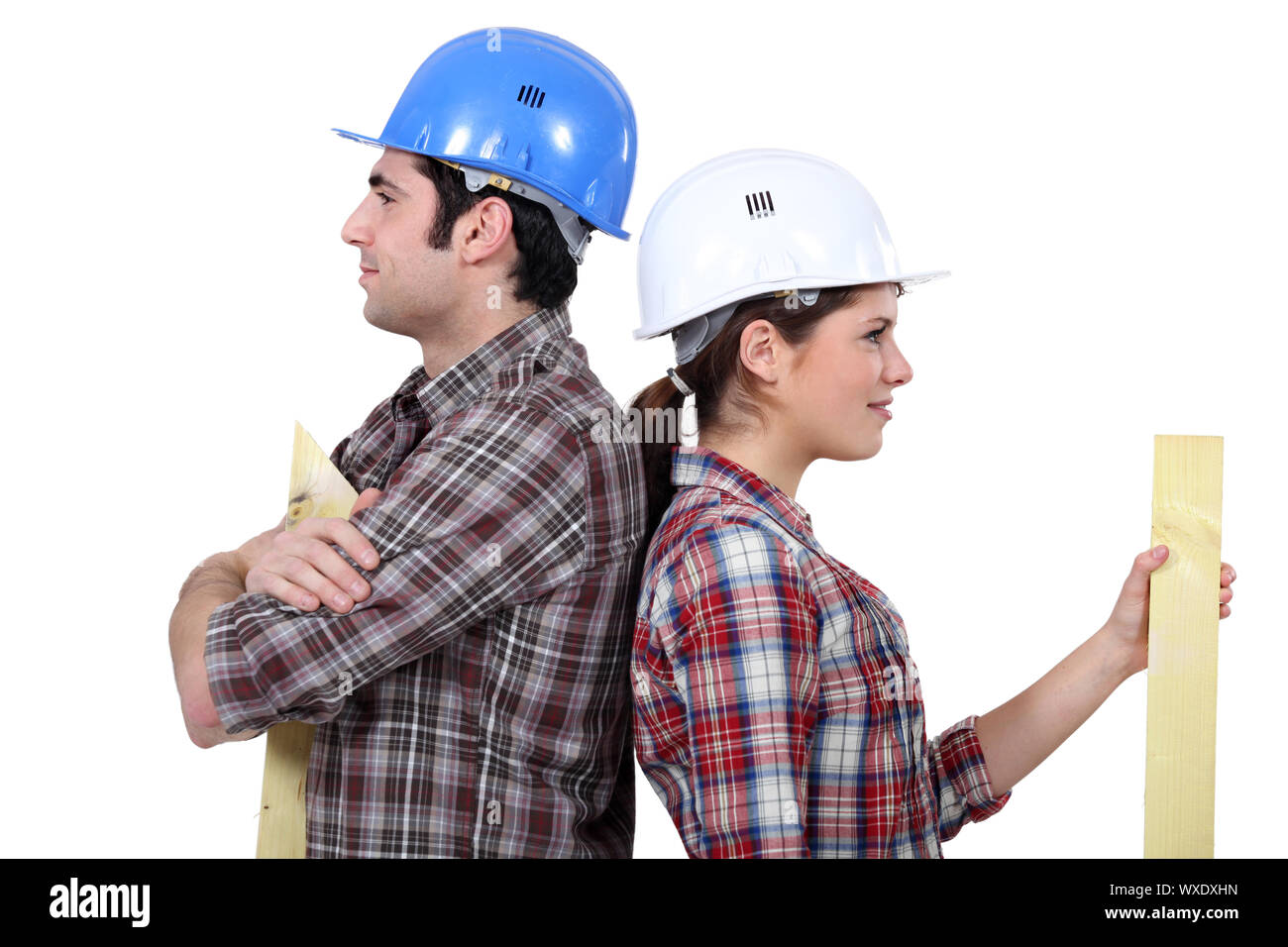 Male and female builders back to back Stock Photo - Alamy