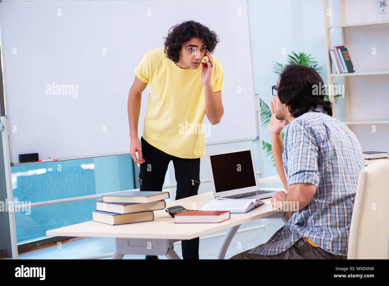 Two male students in the classroom Stock Photo - Alamy