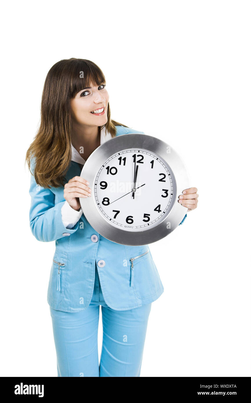 Beautiful woman standing over a white background with a clock on the ...