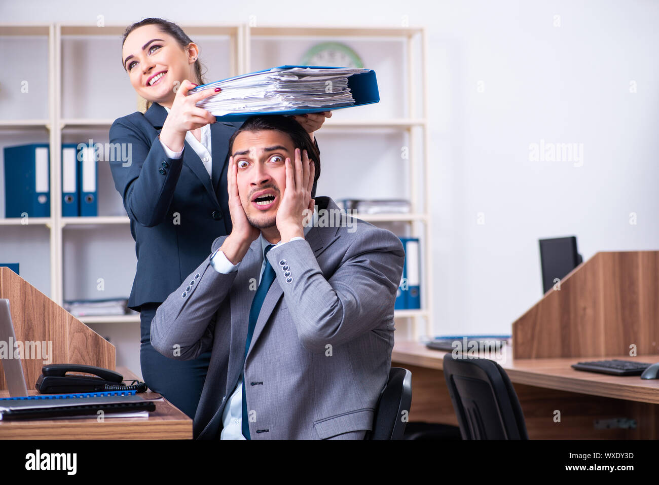 Two employees working in the office Stock Photo - Alamy