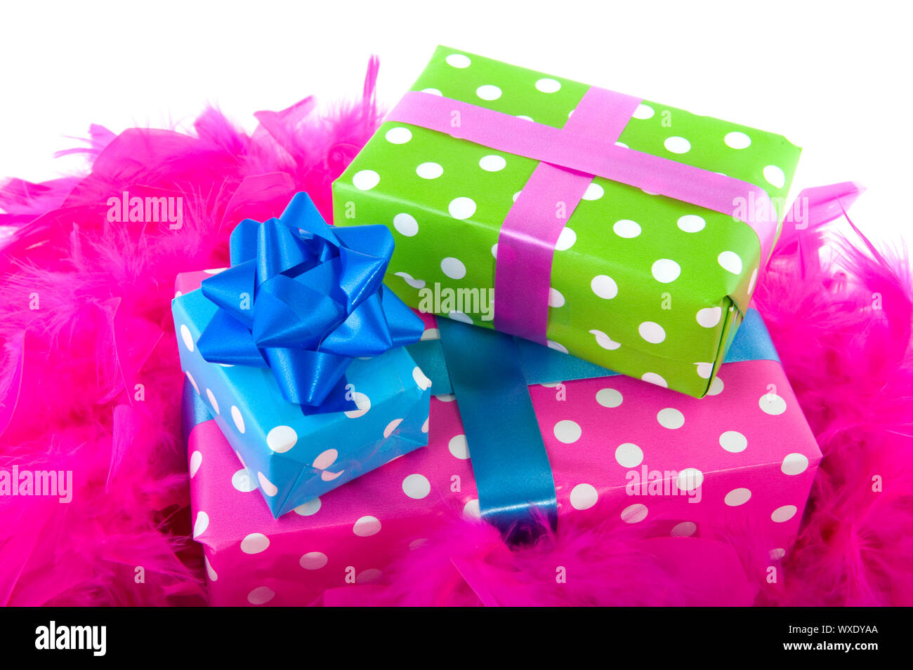 Colorful wrapped presents with ribbon dotted and stacked Stock Photo ...