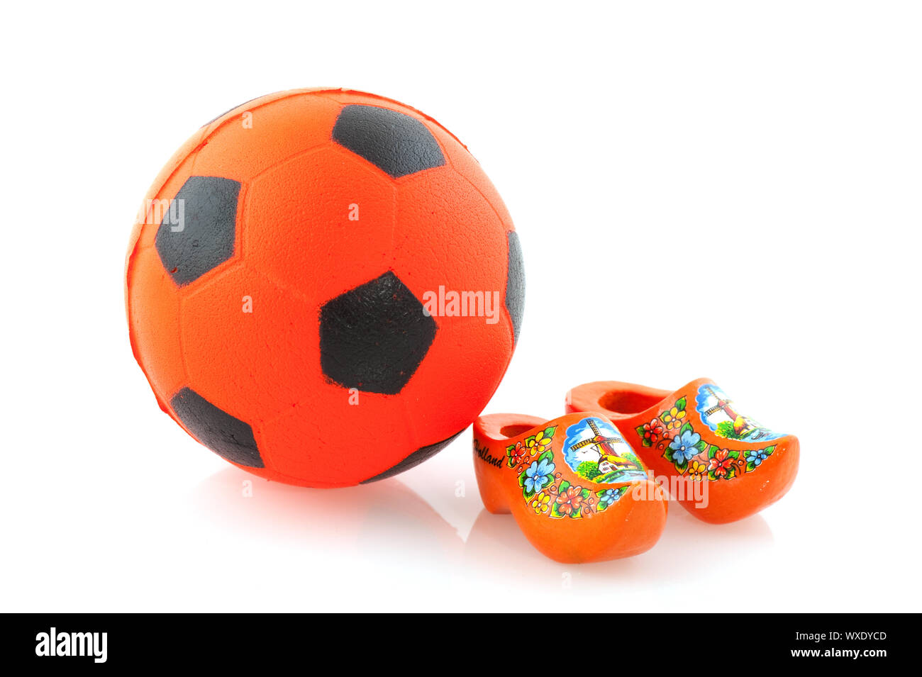 Dutch soccer symbols with orange ball and clogs Stock Photo - Alamy