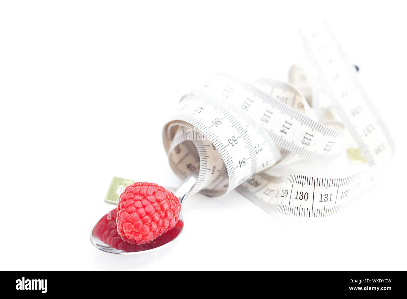 raspberry and measure tape isolated on white Stock Photo - Alamy