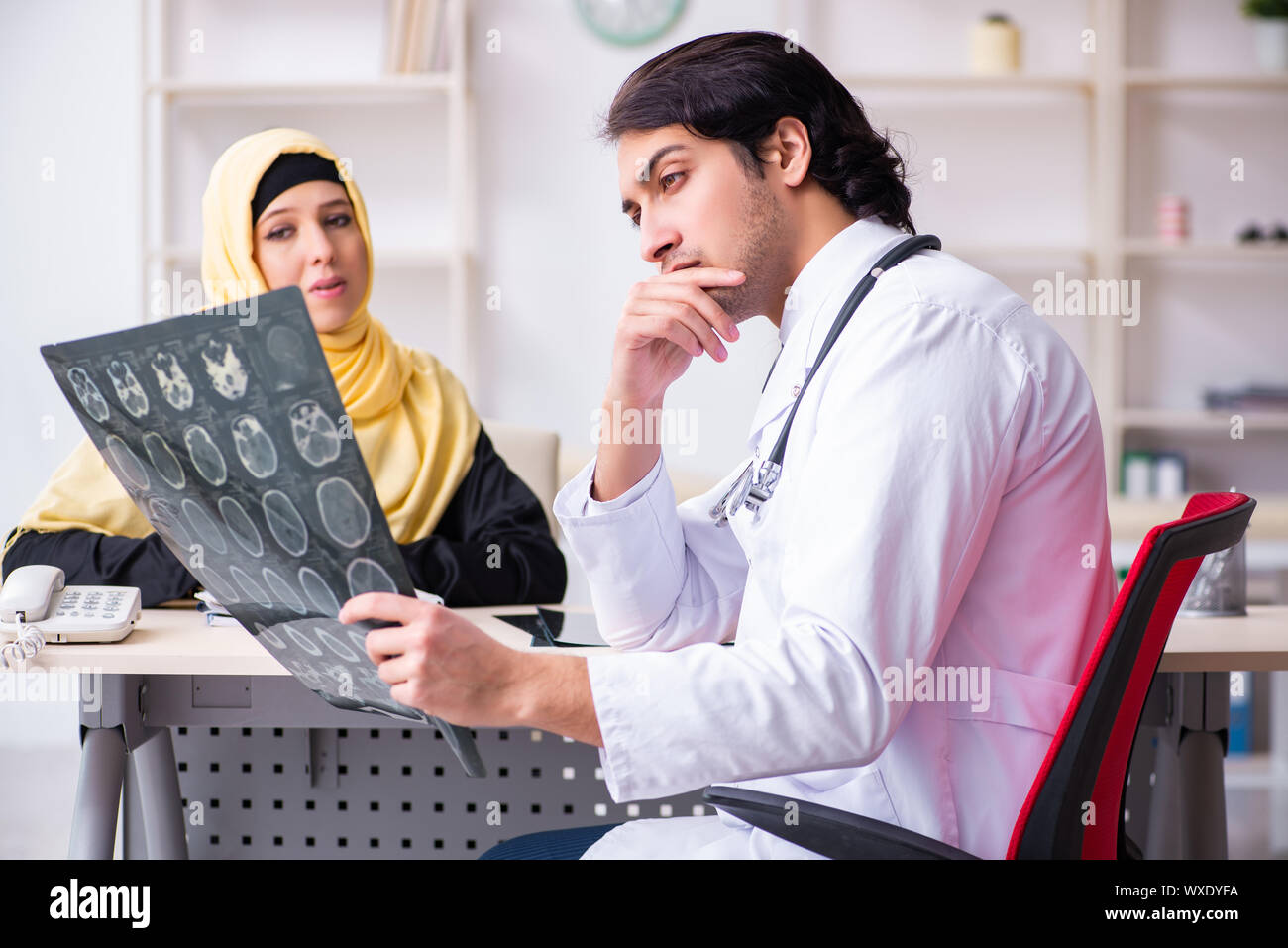 Female arab patient visiting male doctor Stock Photo - Alamy