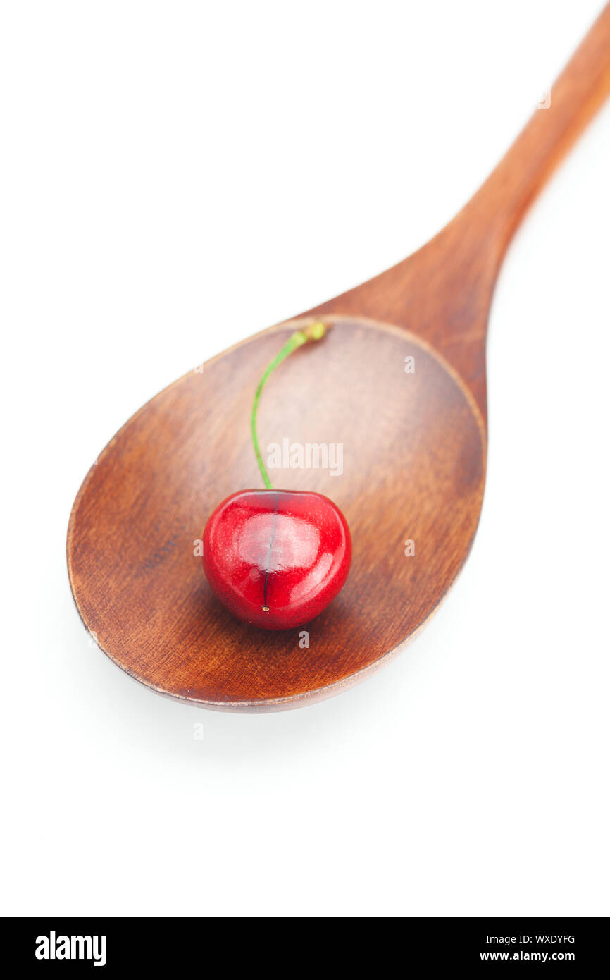 wooden spoon and cherry isolated on white Stock Photo - Alamy