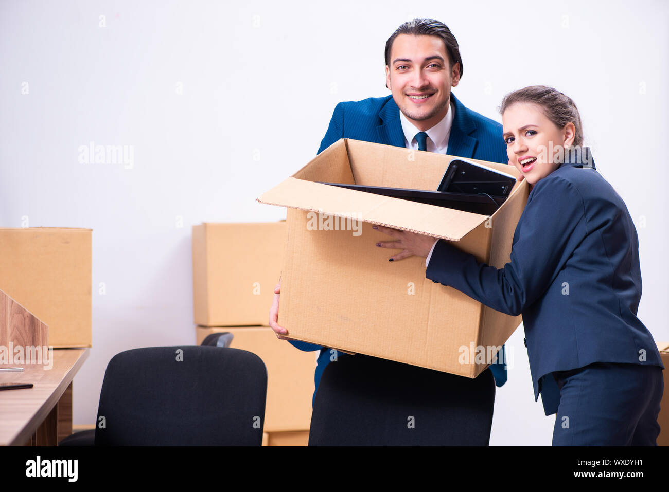 Two employees being fired from their work Stock Photo - Alamy