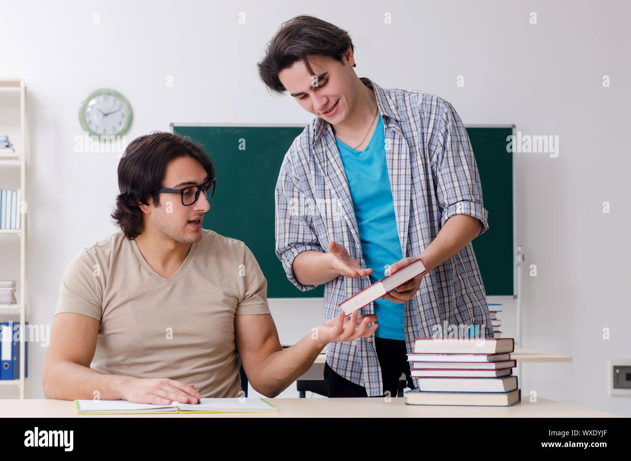 Two male students in the classroom Stock Photo - Alamy