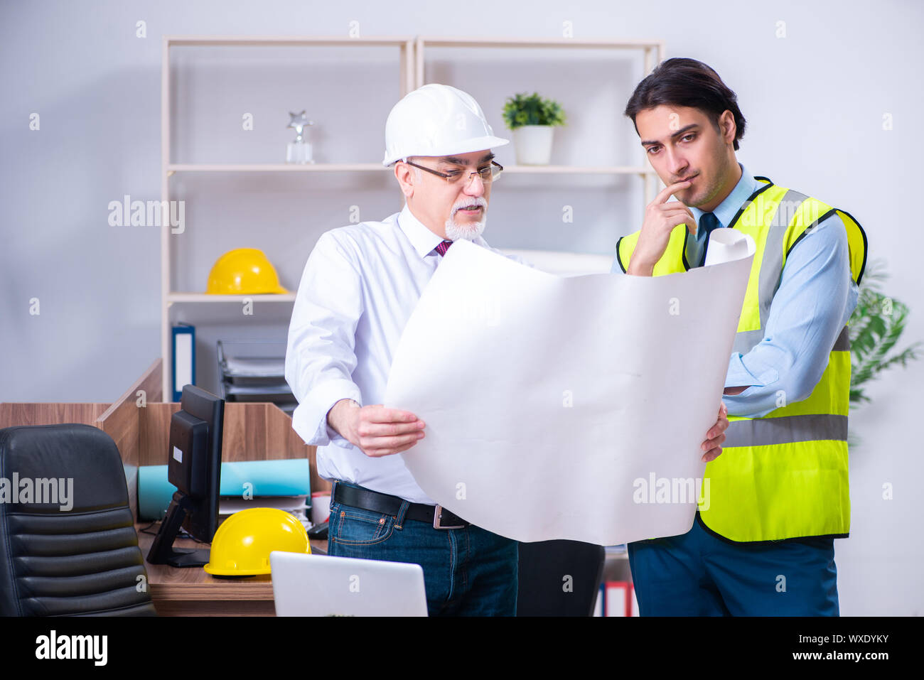 Two architects working on the project Stock Photo - Alamy