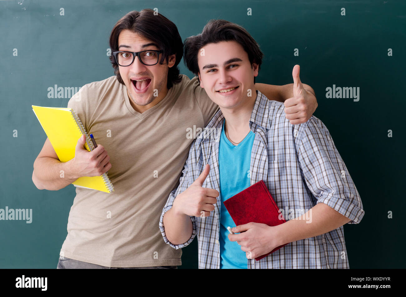 Two male students in the classroom Stock Photo - Alamy