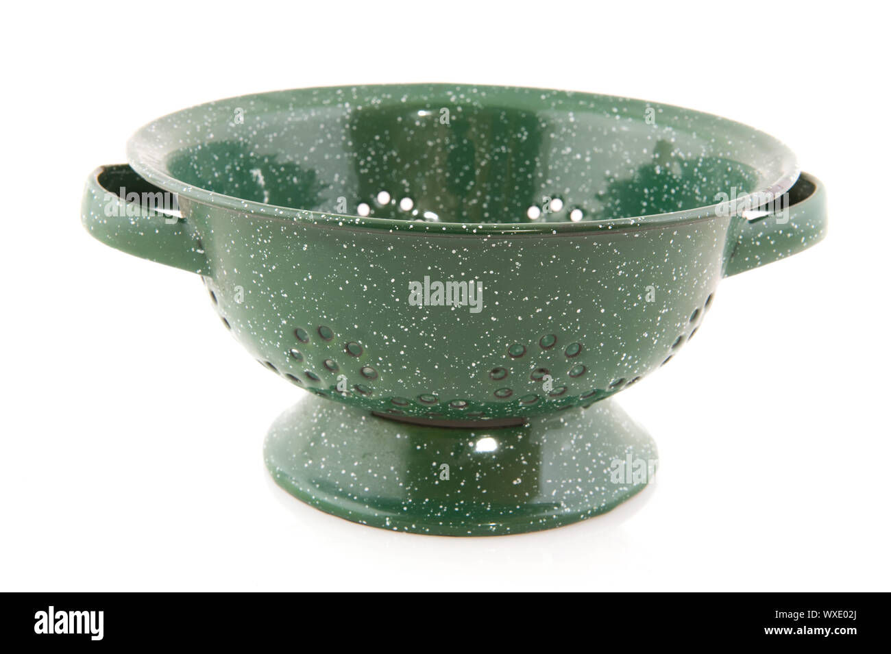 empty green colander from metal isolated over white Stock Photo - Alamy