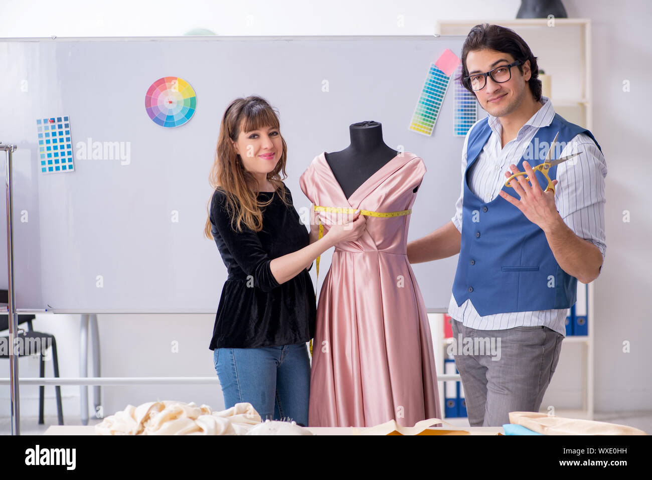 Young tailors working in workshop Stock Photo - Alamy