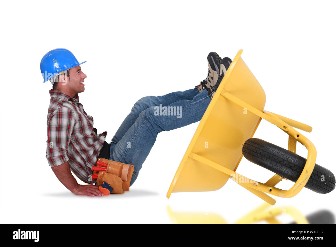 Mason falling from a wheelbarrow Stock Photo - Alamy