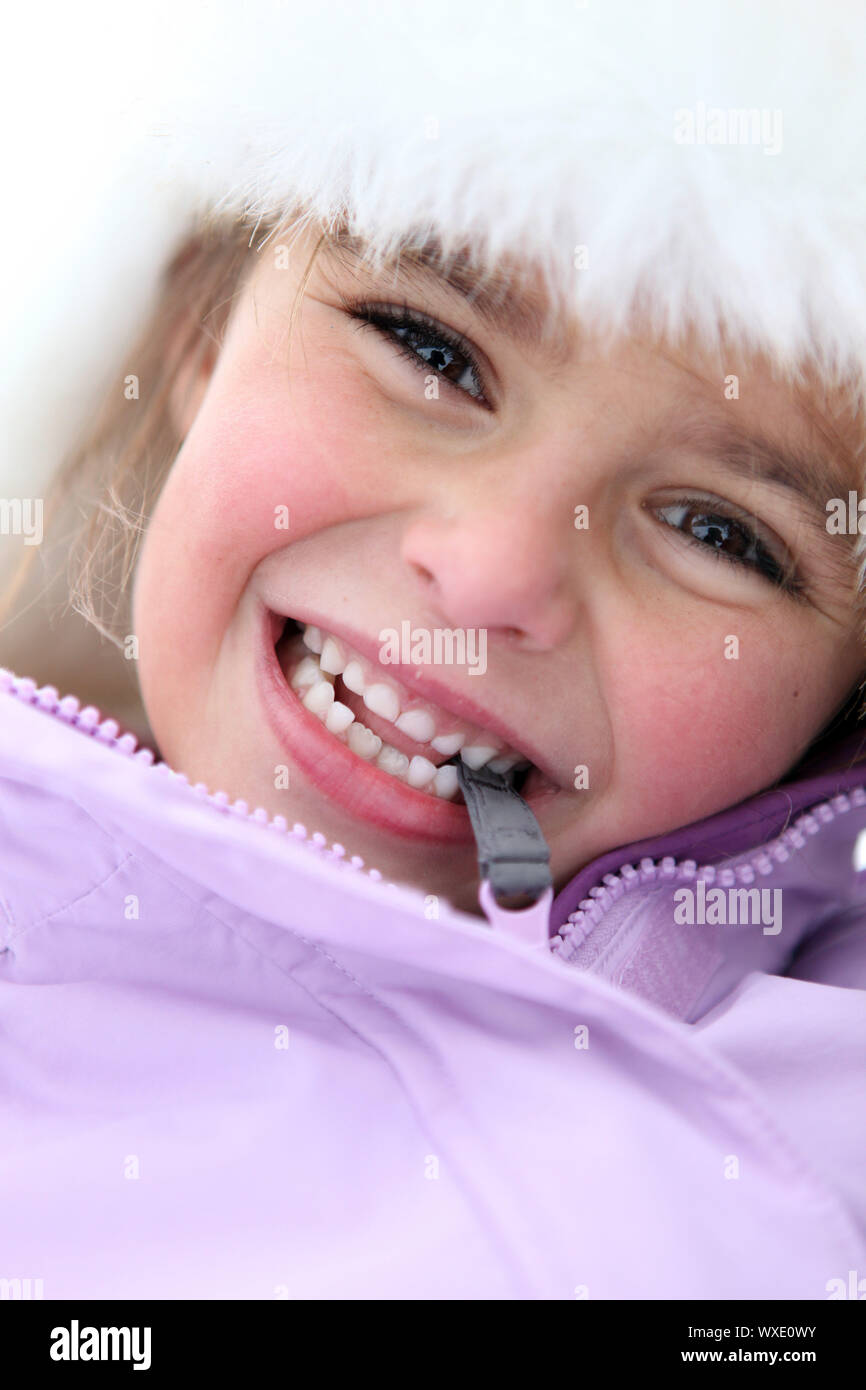 Little girl stood outdoors in winter clothing Stock Photo - Alamy