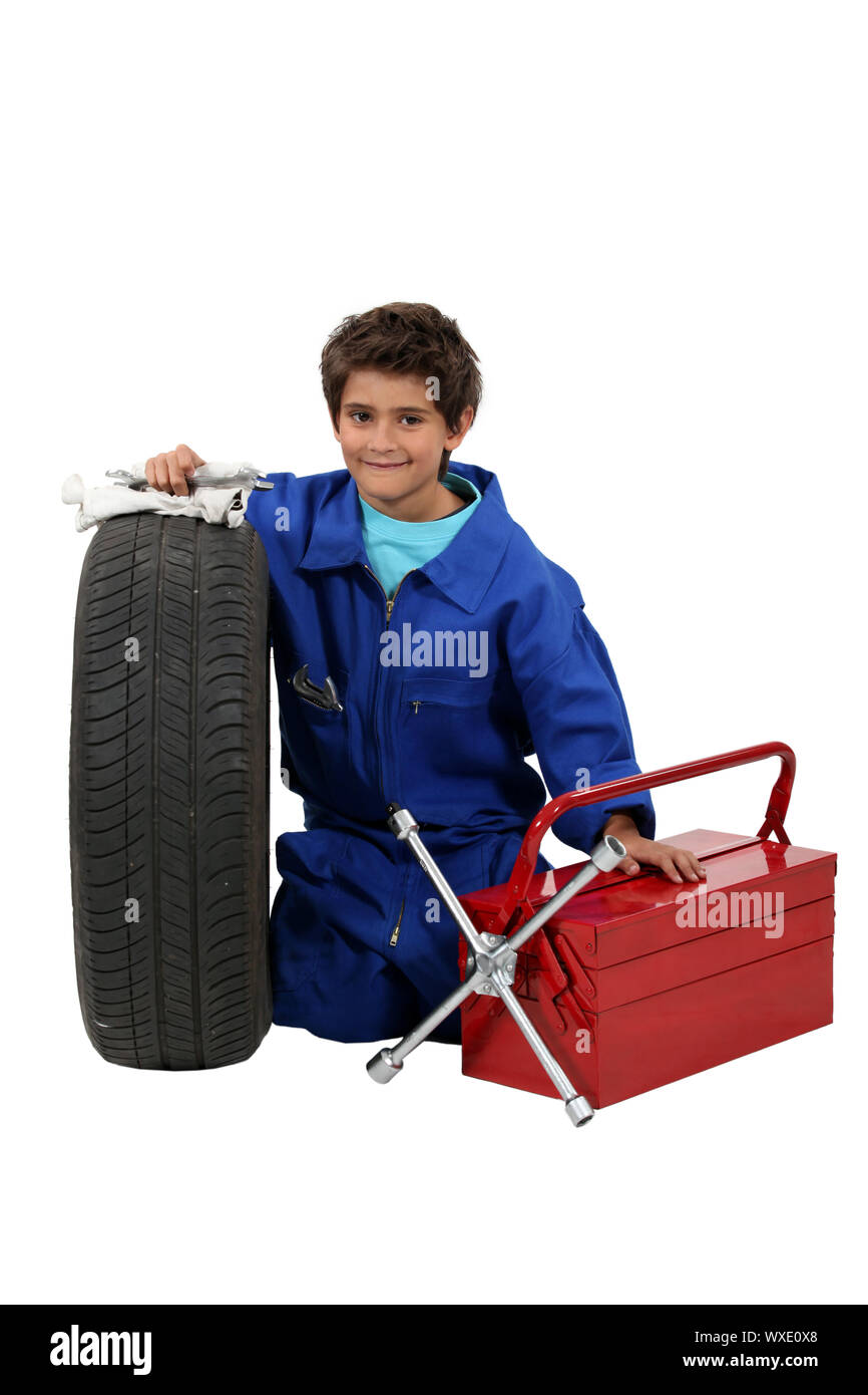Little boy mechanic on white background Stock Photo - Alamy