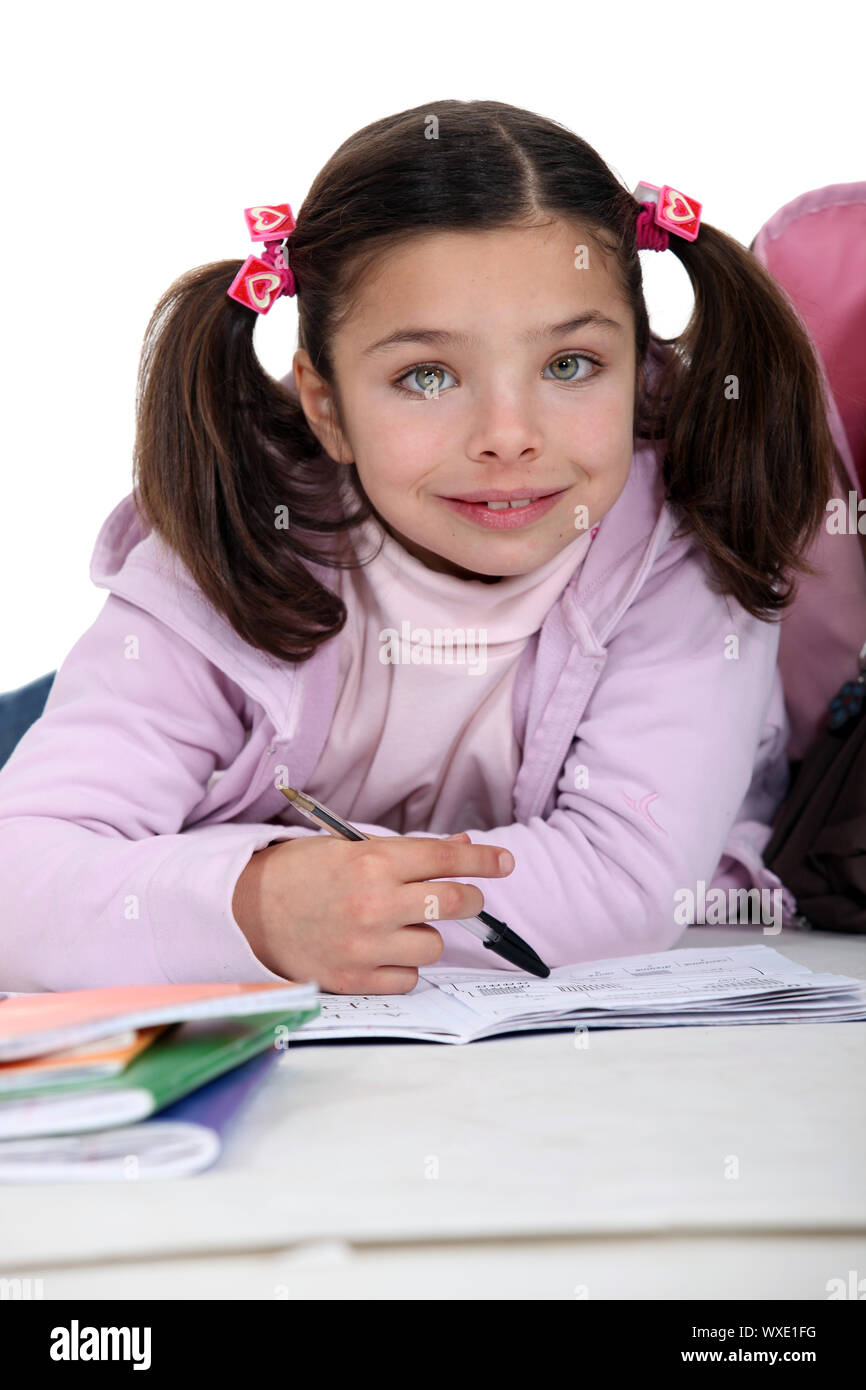 Young girl doing her homework Stock Photo - Alamy