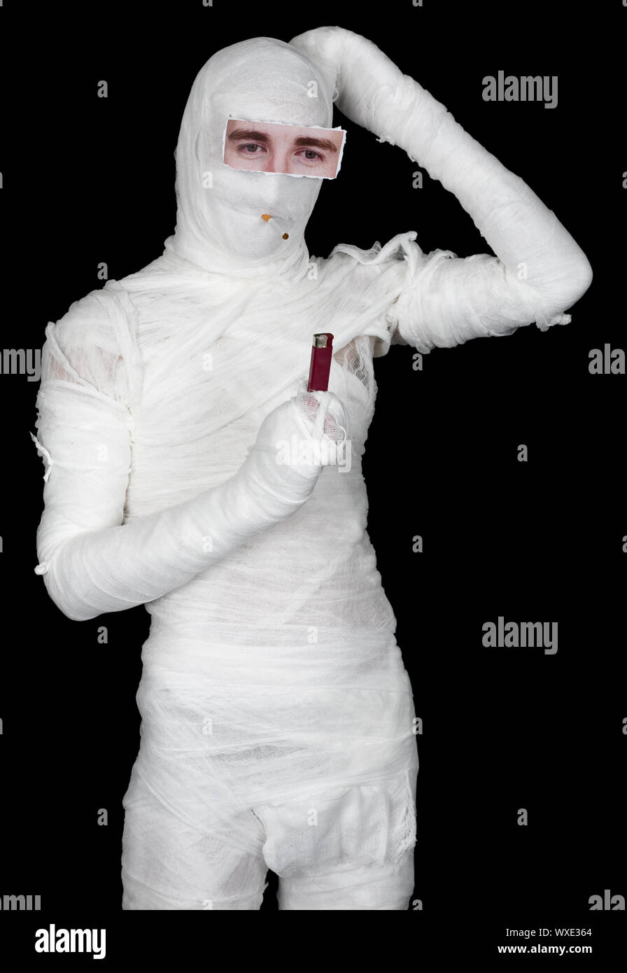 Mummy with eye and lighter on the black background Stock Photo - Alamy