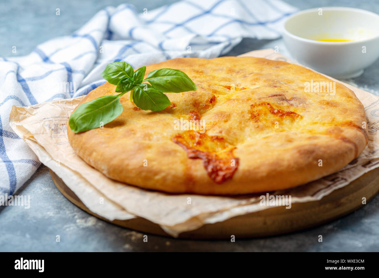 Traditional Georgian closed pie with cheese Stock Photo - Alamy