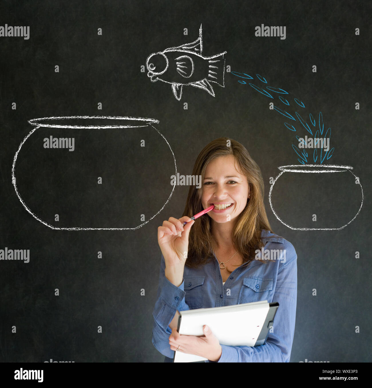 Business woman, student or teacher with fish jumping from small bowl to ...