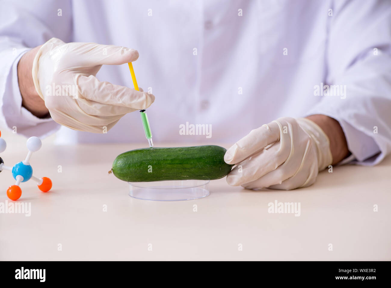 Male nutrition expert testing food products in lab Stock Photo - Alamy