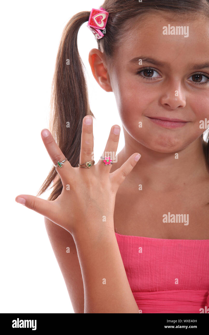 cute little girl showing the rings on her hand Stock Photo - Alamy
