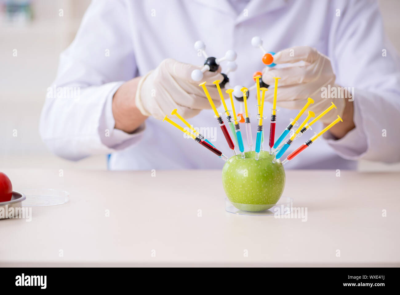 Male nutrition expert testing food products in lab Stock Photo - Alamy