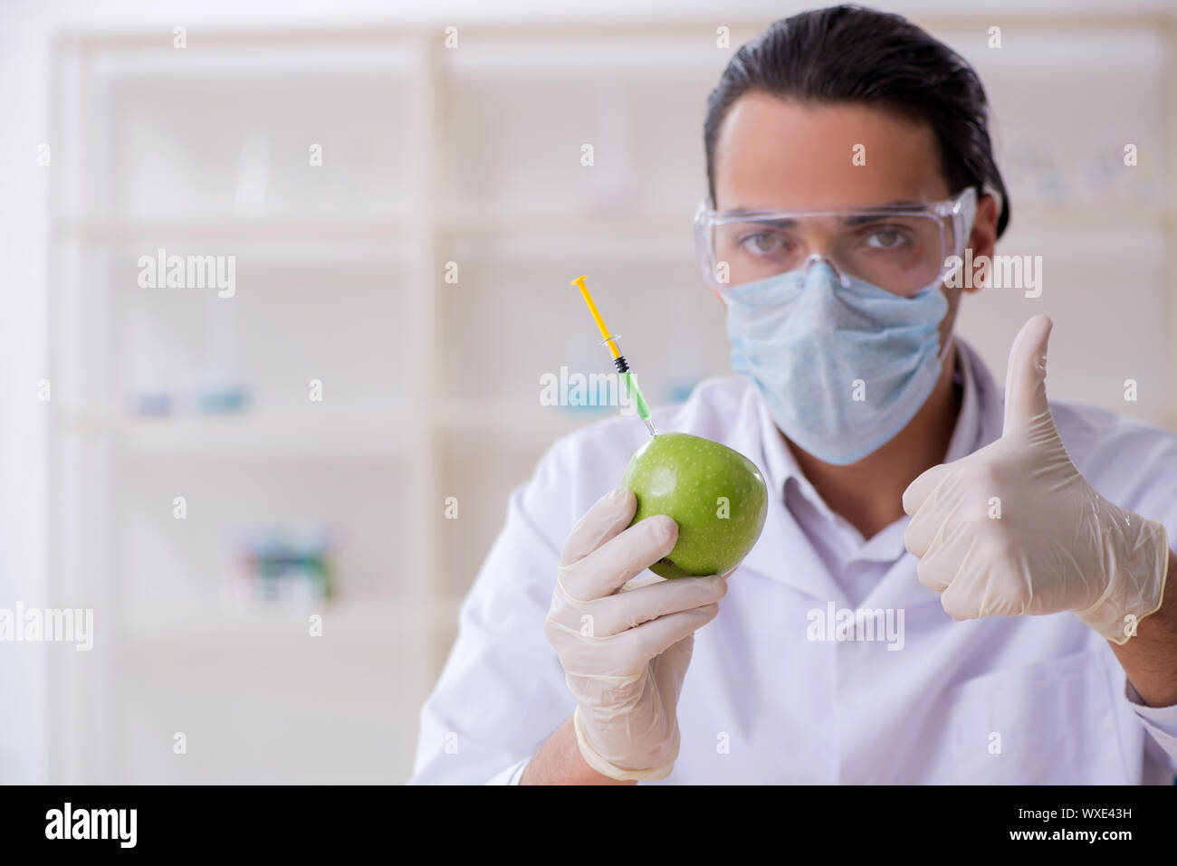 Male nutrition expert testing food products in lab Stock Photo - Alamy