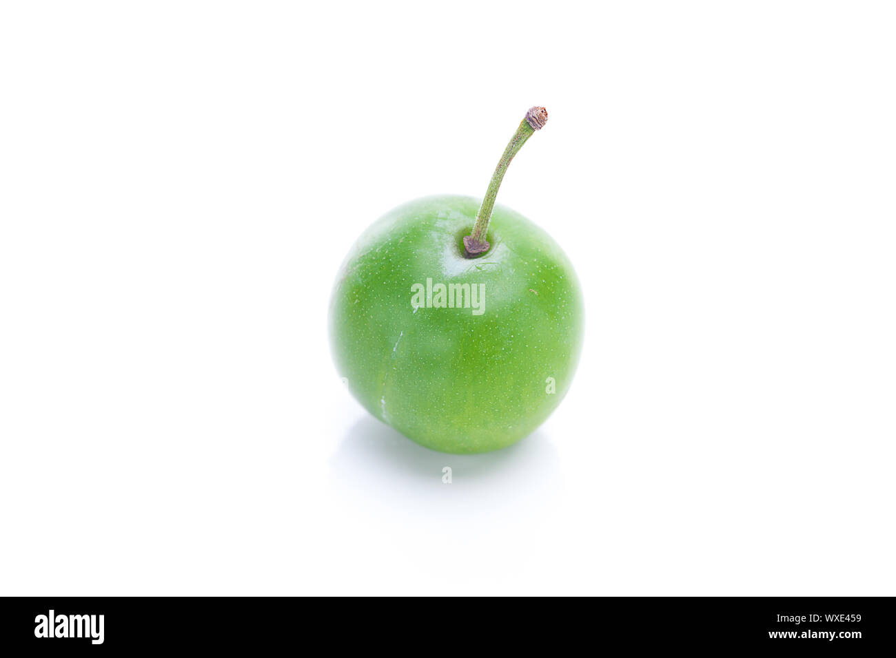 green plum isolated on white Stock Photo - Alamy