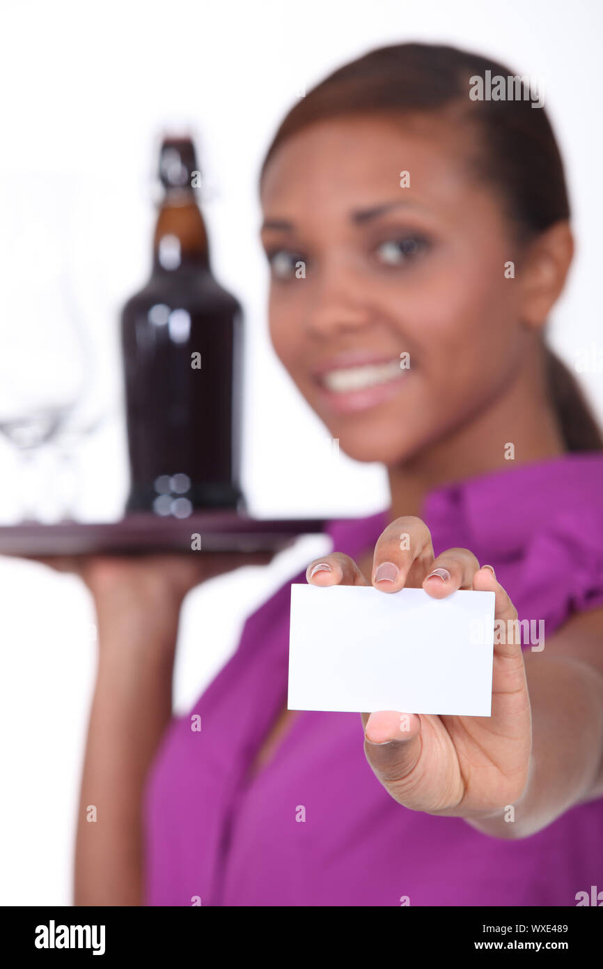 Bar owner showing business card Stock Photo - Alamy