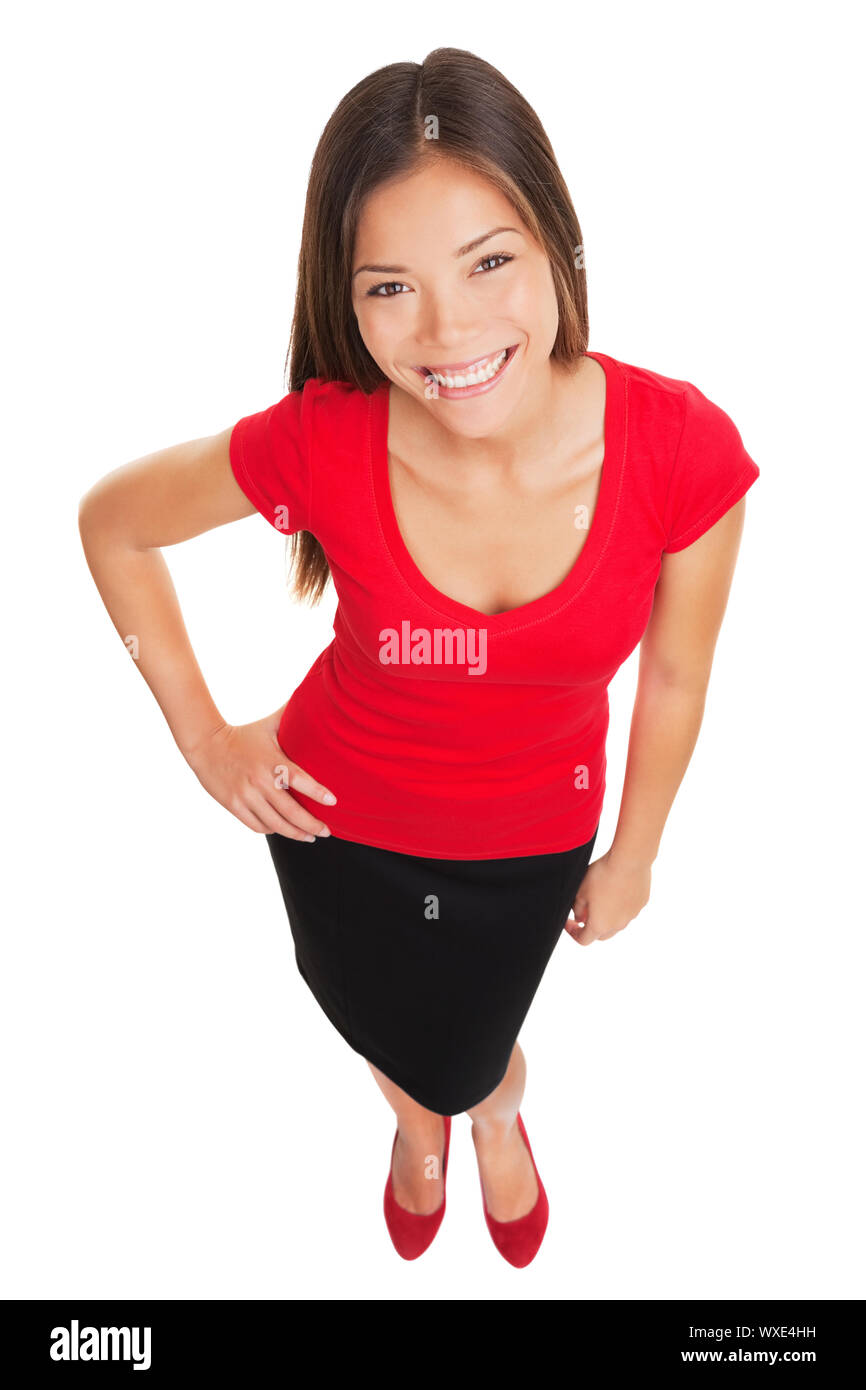 Beautiful stylish woman with charm smiling up at the camera with a ...