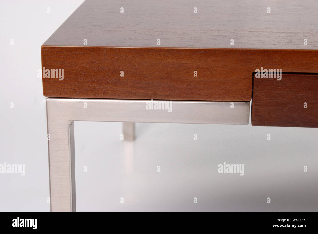 Wooden and metal coffee table close up. Front view. White background ...