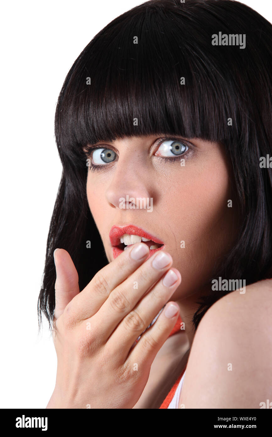 Young woman staring in shock Stock Photo - Alamy