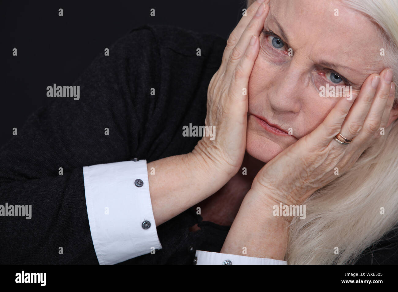 Elderly woman suffering Stock Photo - Alamy