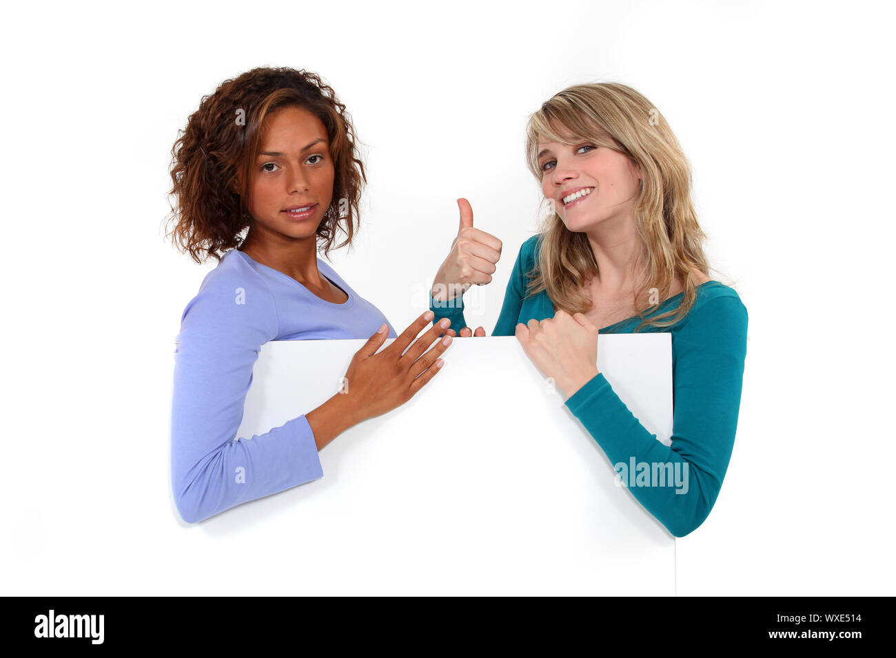Two young friends pose Cut Out Stock Images & Pictures - Alamy