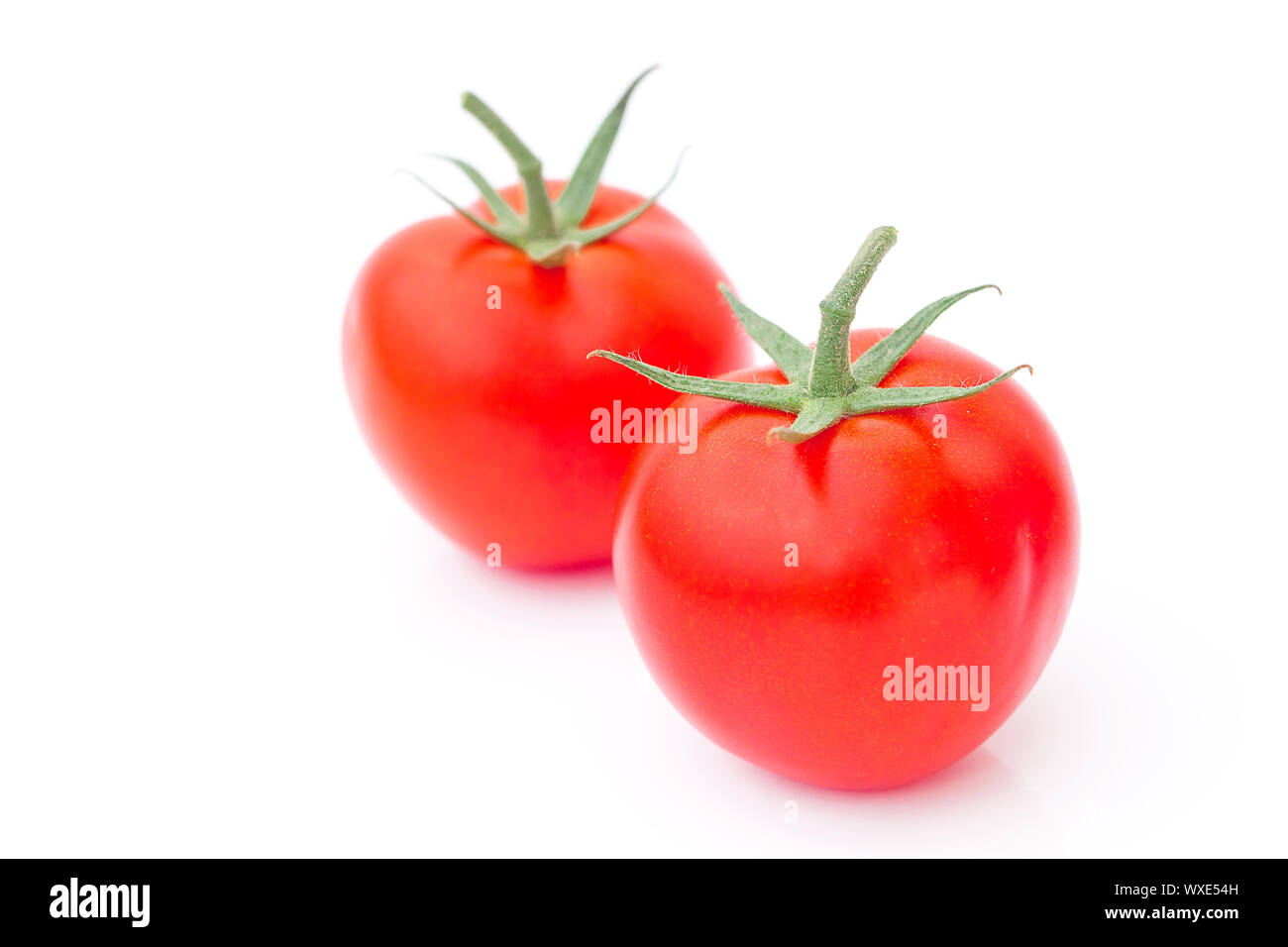 red ripe tomato isolated on white Stock Photo - Alamy