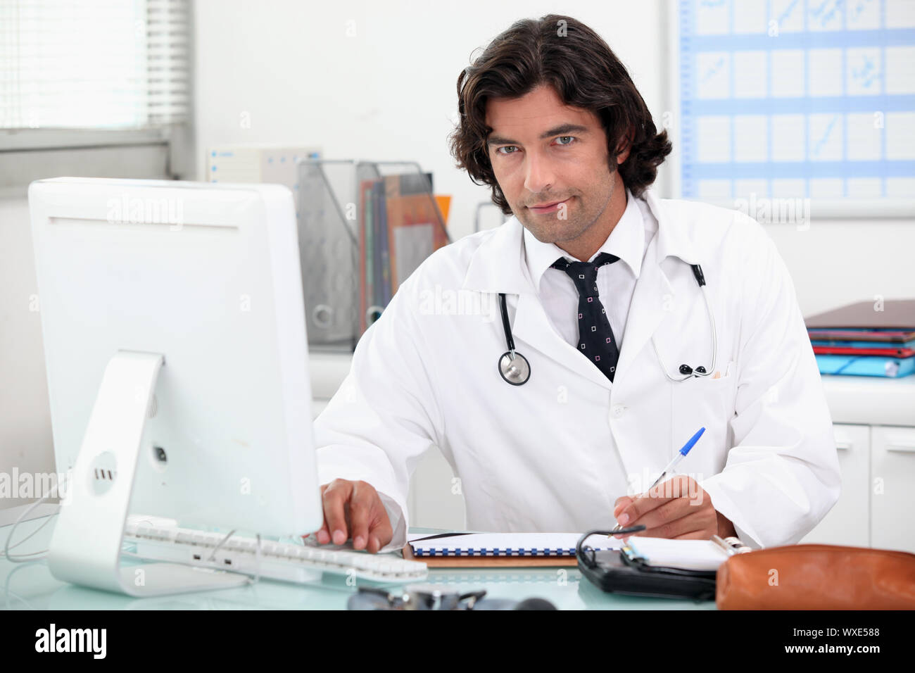 Doctor at a computer Stock Photo - Alamy