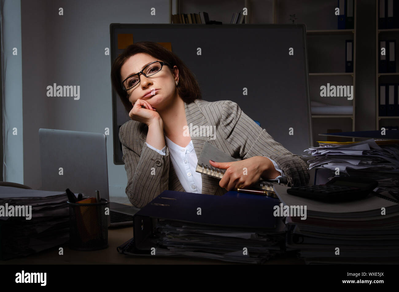 Female employee suffering from excessive work Stock Photo - Alamy