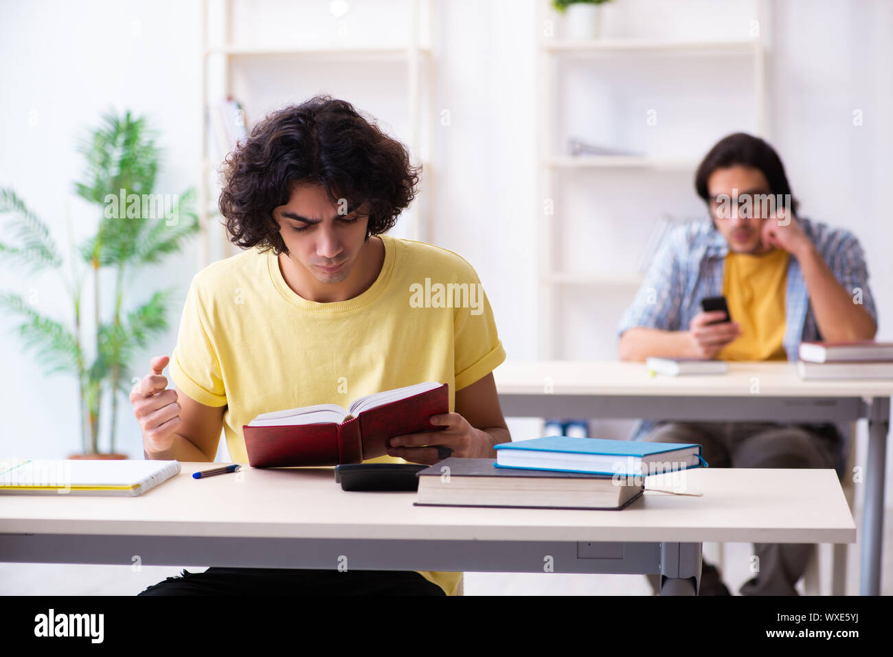 Two male students in the classroom Stock Photo - Alamy