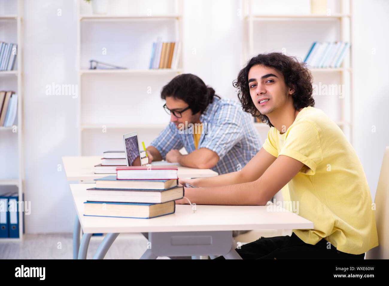 Two male students in the classroom Stock Photo - Alamy