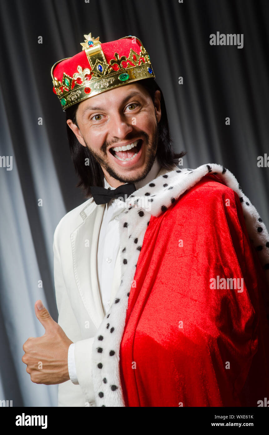 Funny king wearing crown in coronation concept Stock Photo - Alamy