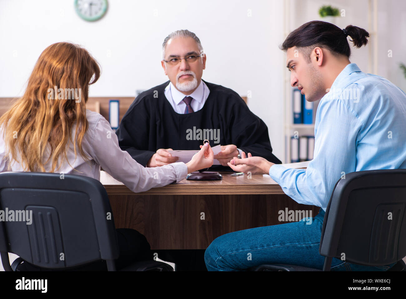 Young couple in the courthouse in divorce concept Stock Photo - Alamy