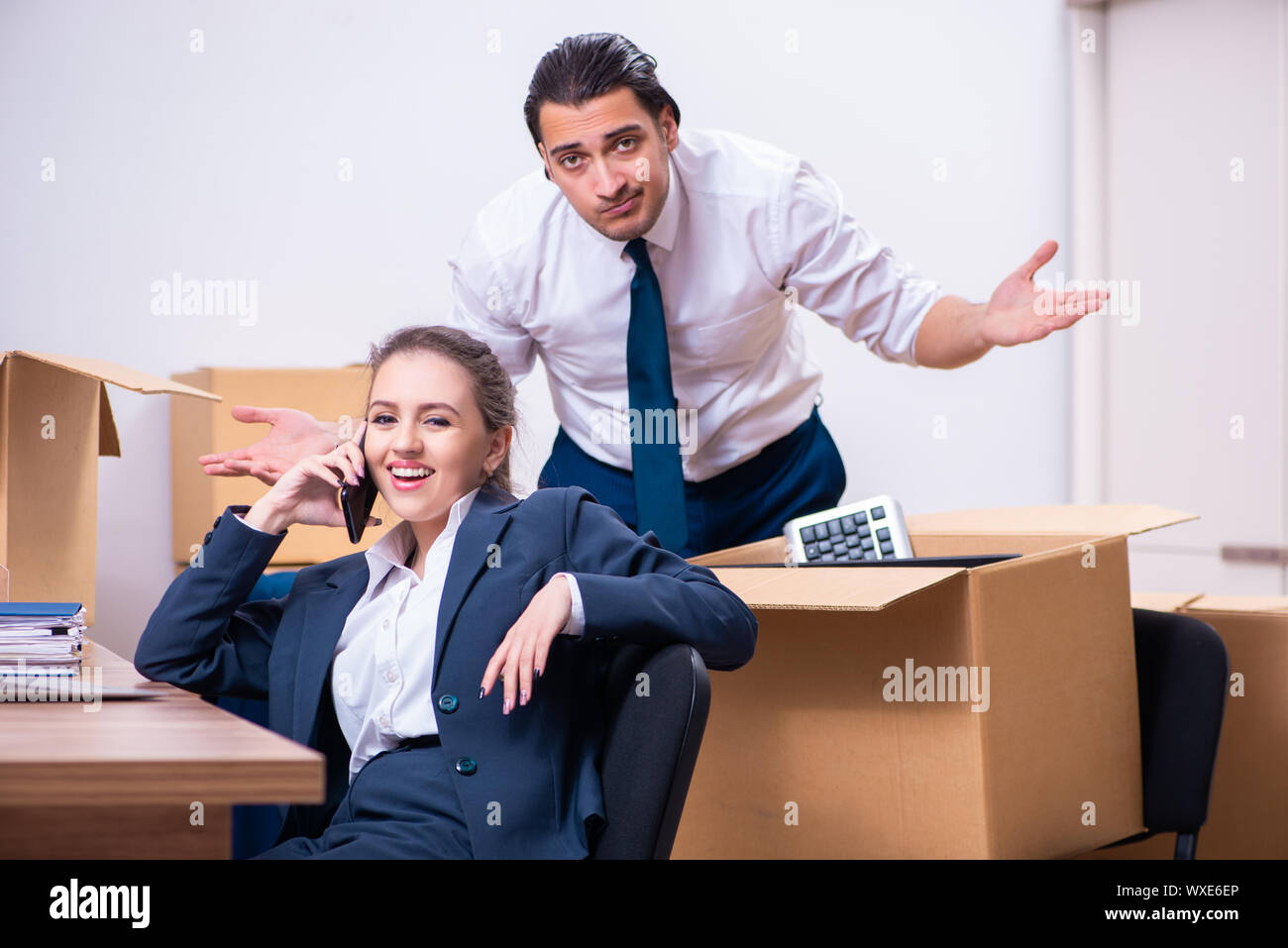 Two employees being fired from their work Stock Photo - Alamy